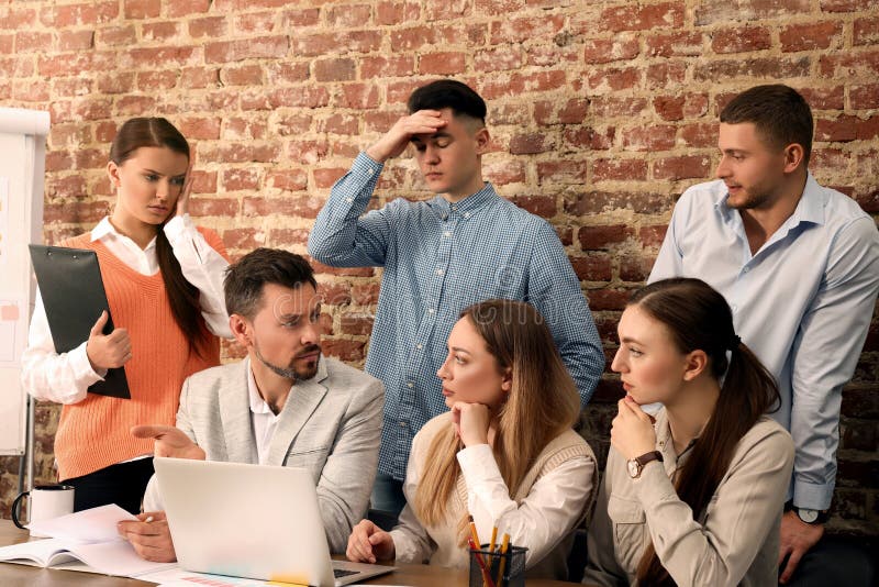 Team of Employees Working Together on Difficult Task in Office Stock ...