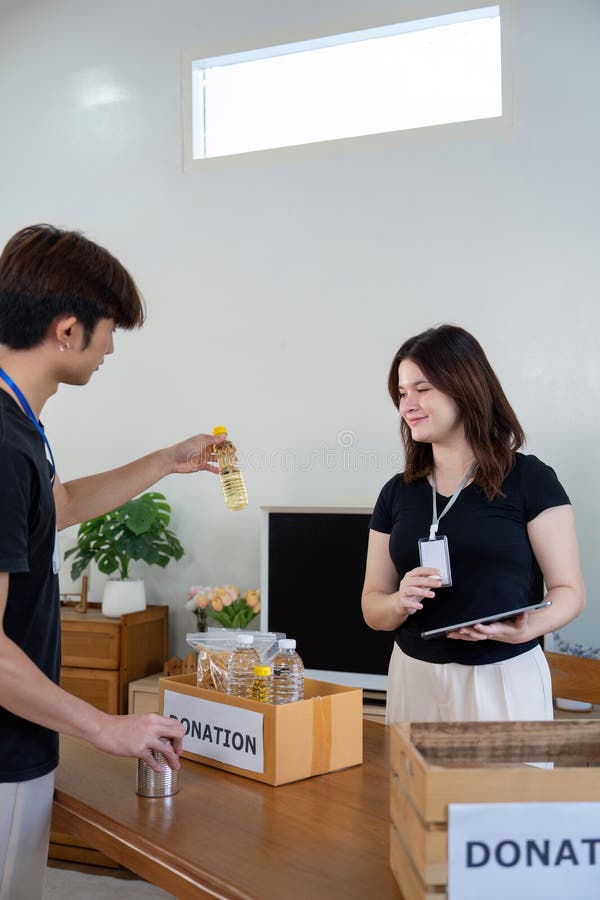 Team Engaging in Donation Sorting for Outreach Program Stock Photo ...