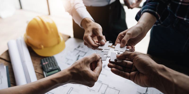 Team of Engineer and Architects Working Join Hands To Build Successful ...