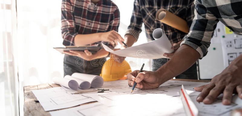 Team of Engineer and Architects Working Join Hands To Build Successful ...