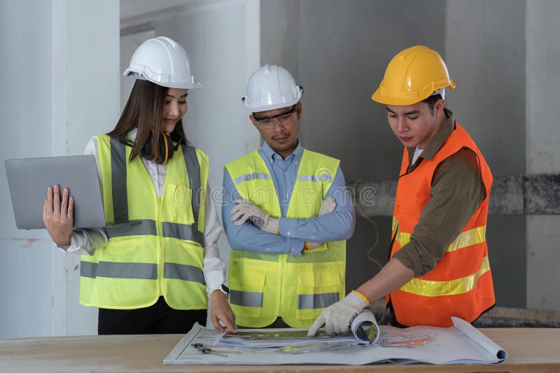 Team of Engineer and Architects Working, Meeting, Discussing, Designing, Planning, Measuring ...