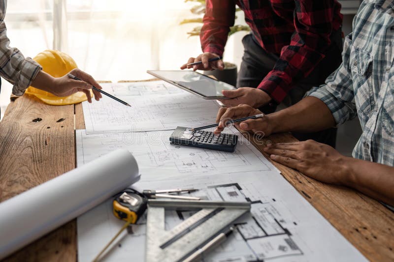 Team Engineer Checks Construction Blueprints on New Project with ...