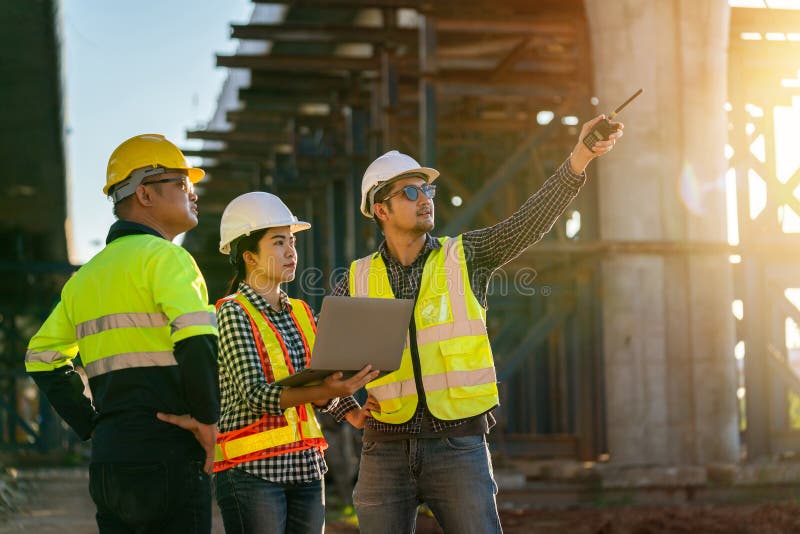A Team of Engineers and Architects Analyzes Projects Under Construction ...