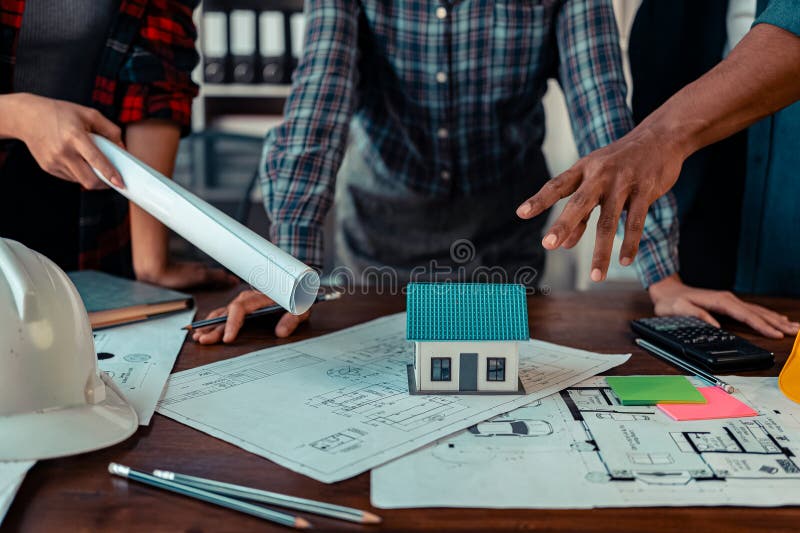 Team of Engineers and Architects Working, Planning, Measuring Diagrams ...