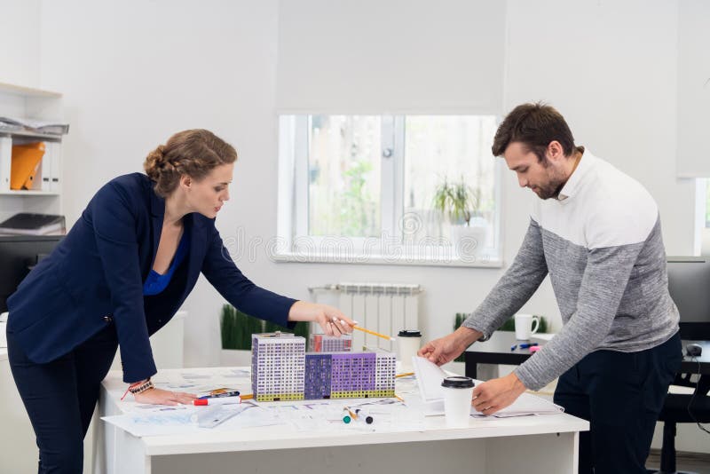 A Team of Engineers Brainstorming Ideas about Their Project Stock Image ...