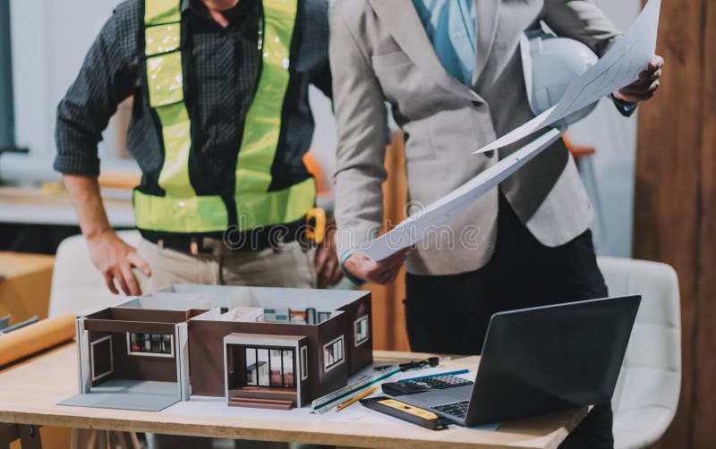 Team Engineers with Draft Plan of Building on Constructing Site ...