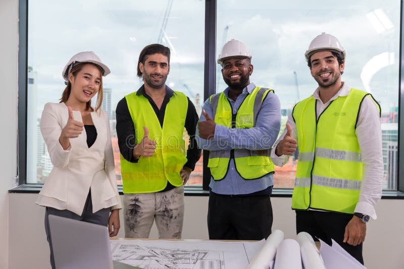 Team Engineers with Draft Plan of Building on Constructing Site ...