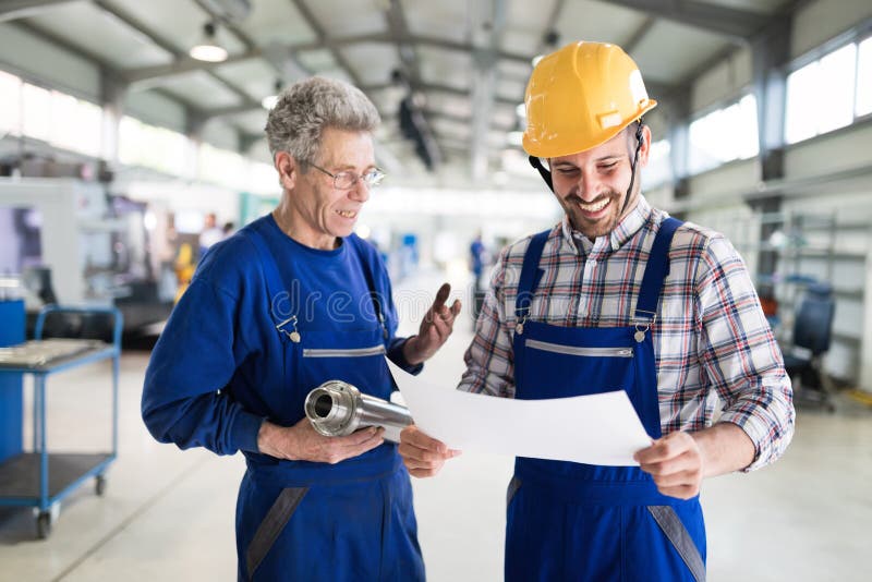 Team of Engineers Having Discussion in Factory Stock Photo - Image of ...