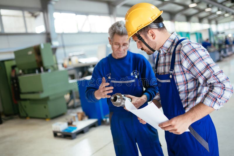 Team of Engineers Having Discussion in Factory Stock Image - Image of ...