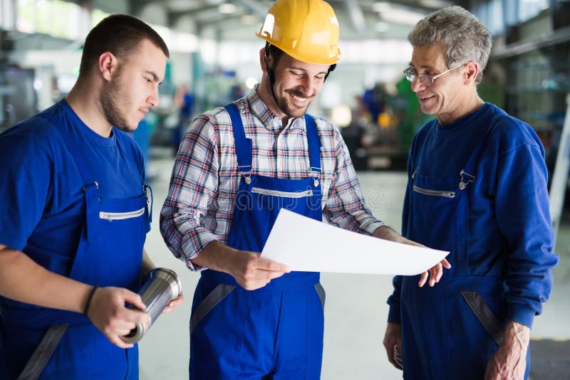 Team of Engineers Having Discussion in Factory Stock Photo - Image of ...