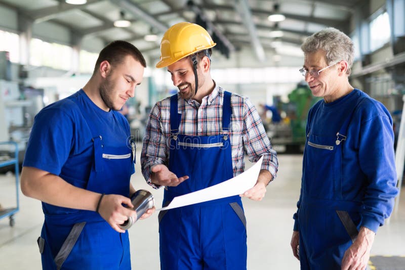 Team of Engineers Having Discussion in Factory Stock Photo - Image of ...