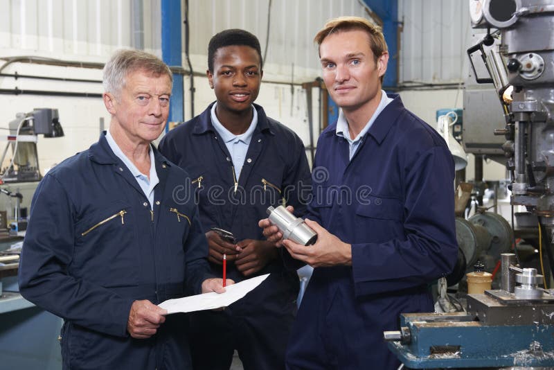 Team of Engineers Having Discussion in Factory Stock Photo - Image of ...