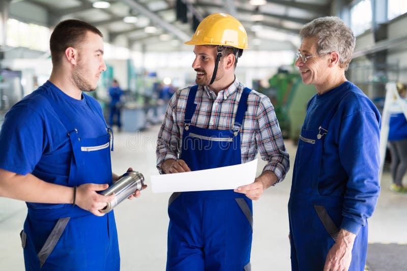 Team of Engineers Having Discussion in Factory Stock Image - Image of ...