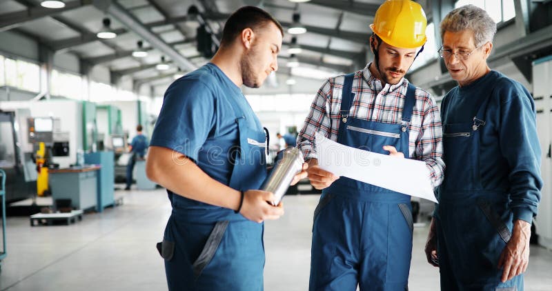 Team of Engineers Having Discussion in Factory Stock Photo - Image of ...