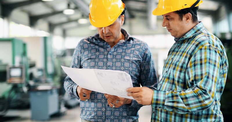 Discussion on Factory Floor Stock Photo - Image of inspector ...