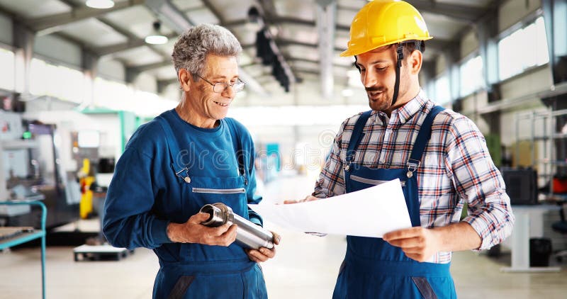 Team of Engineers Having Discussion in Factory Stock Photo - Image of ...