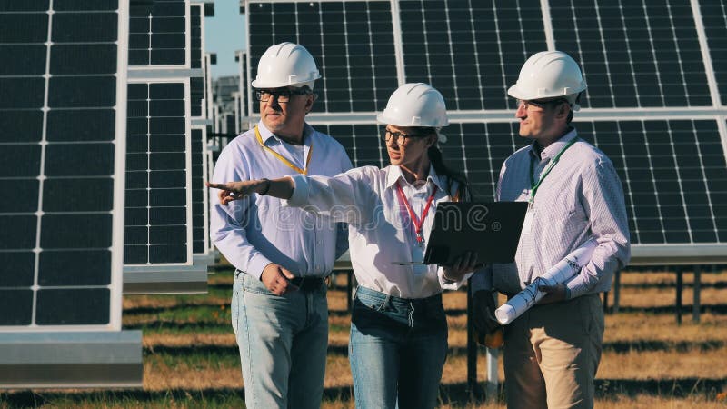 Team of Engineers are Planning a Project with Solar Panels. Renewable ...