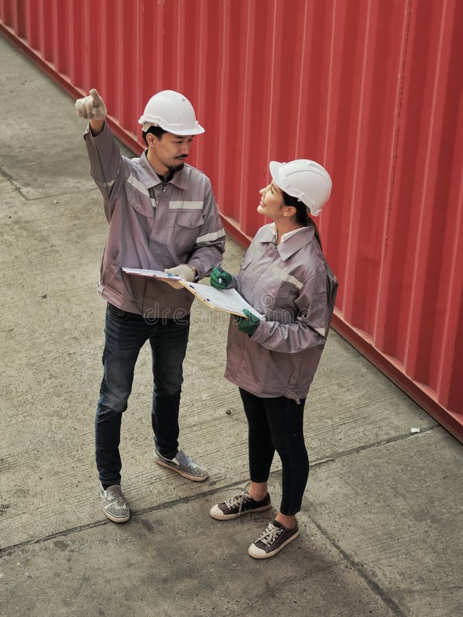 A Team of Engineers Waving Hand To Say Hello, Greeting Someone Stock ...