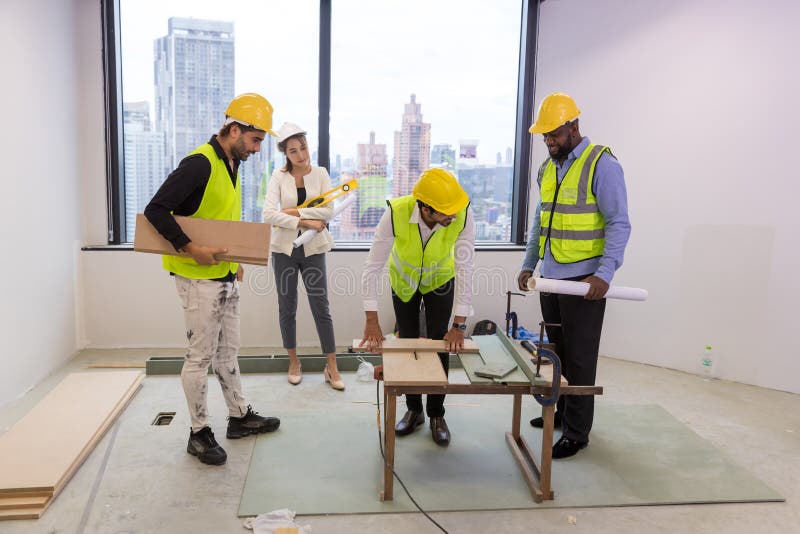 Team Engineers Worki Nbuilding on Constructing Site. Stock Image ...