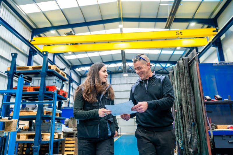 Team of Engineers Working in a Cnc Logistics Factory Stock Image ...