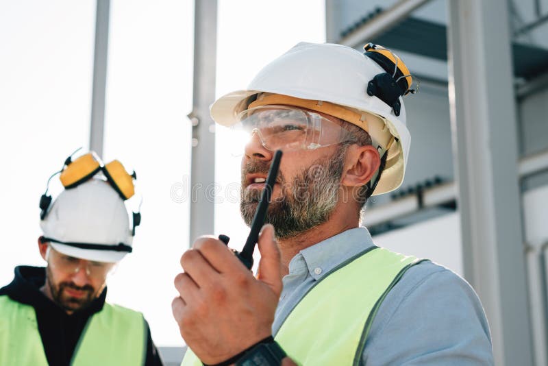 Team of Engineers Working on Construction Site Stock Photo - Image of ...