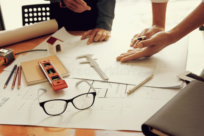 Team of Engineers Working Together. Stock Photo - Image of blueprint ...