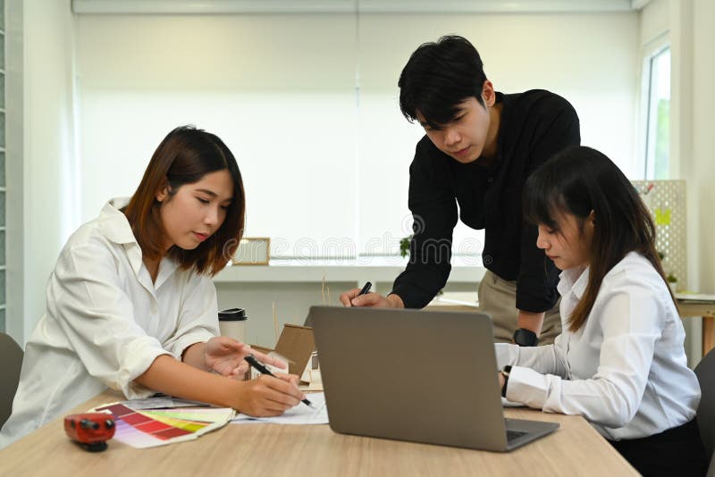 Team of Experienced Architects Brainstorming, Collaborating on New ...