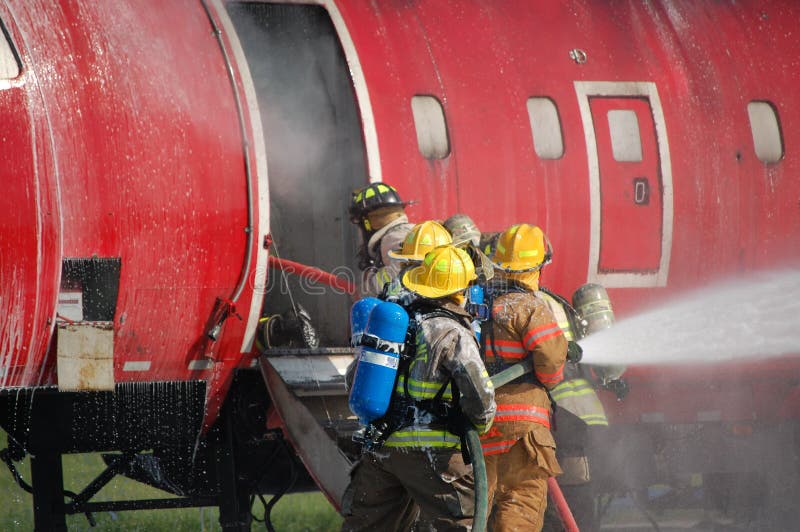 Team of Firefighters Entering Training Aircraft. Stock Photo - Image of ...
