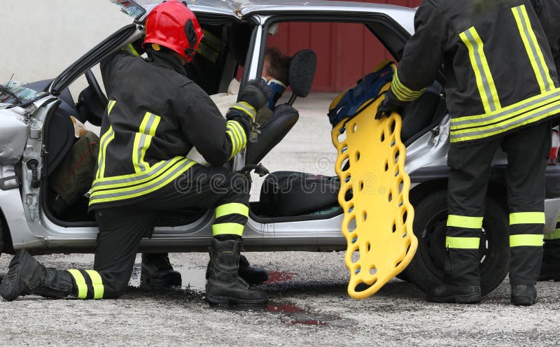 Team of Firefighters on the Road after the Crash Stock Photo - Image of ...