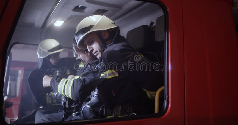Team of Firemen Getting into Truck Stock Photo - Image of protect ...