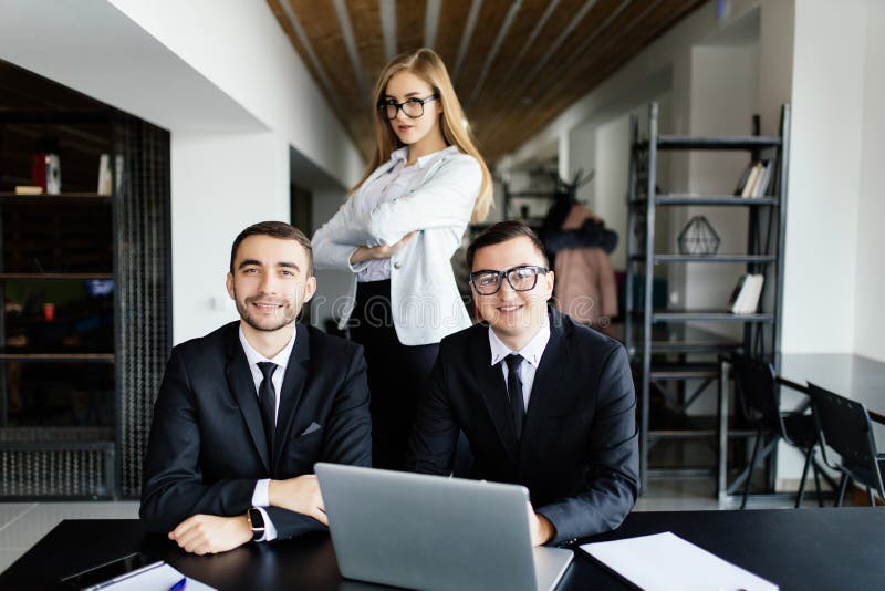 Team gathering at desk stock image. Image of computer - 84930839