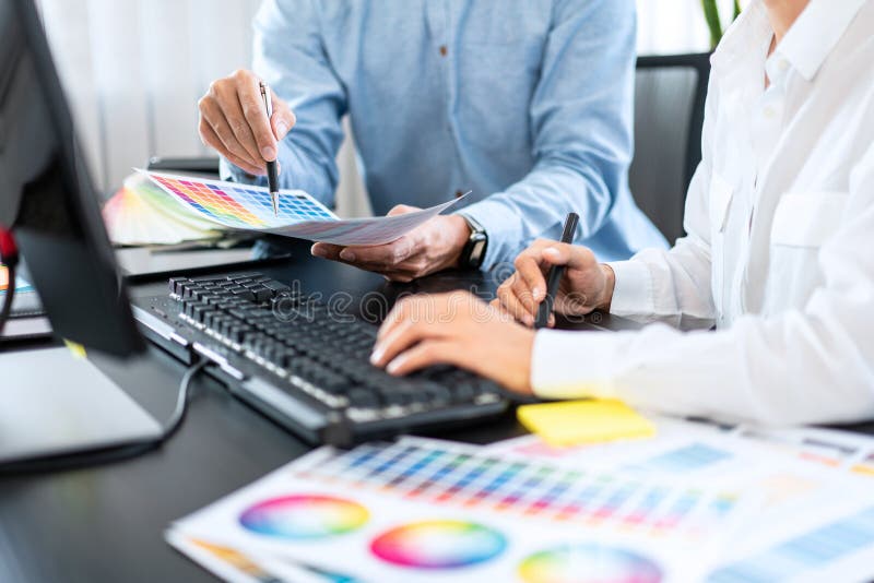 Team Graphic Designer Working on Document of Color Chart To ...