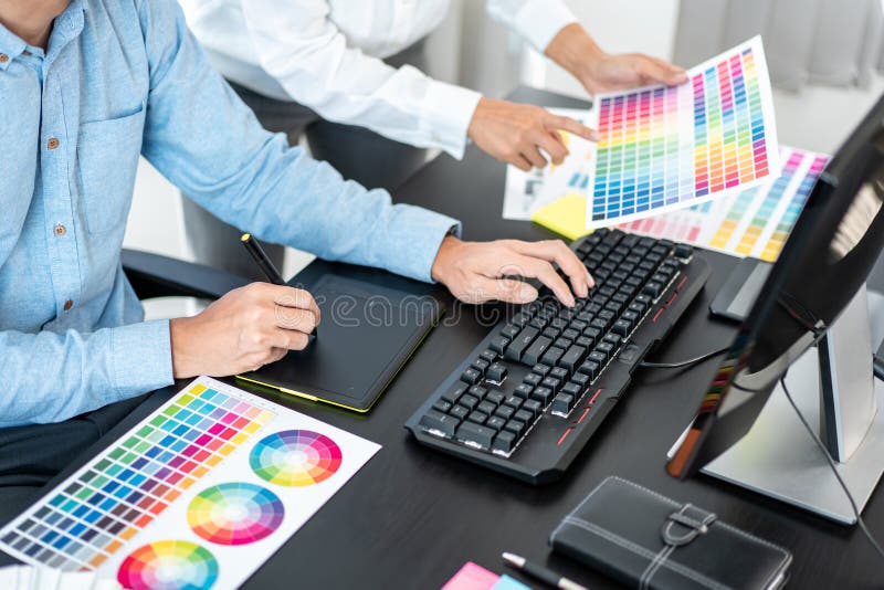 Team Graphic Designer Working on Document of Color Chart To ...