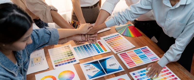 Team of Graphic Designers Building Unity and Solidarity. Scrutinize ...