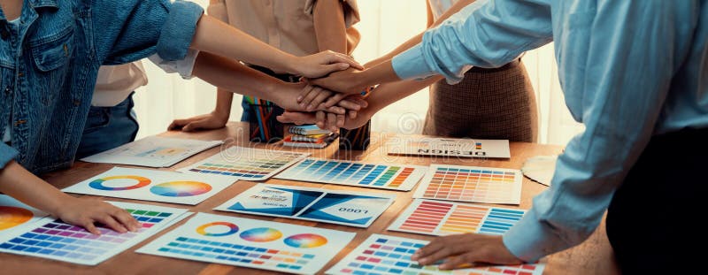 Team of Graphic Designers Building Unity and Solidarity. Scrutinize ...