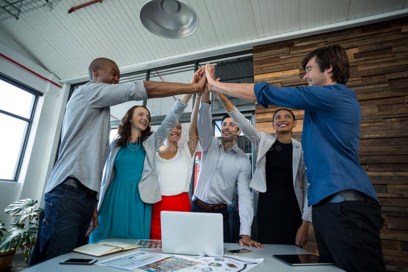 Team of Graphic Designers Giving High Five To Each Other Stock Photo ...