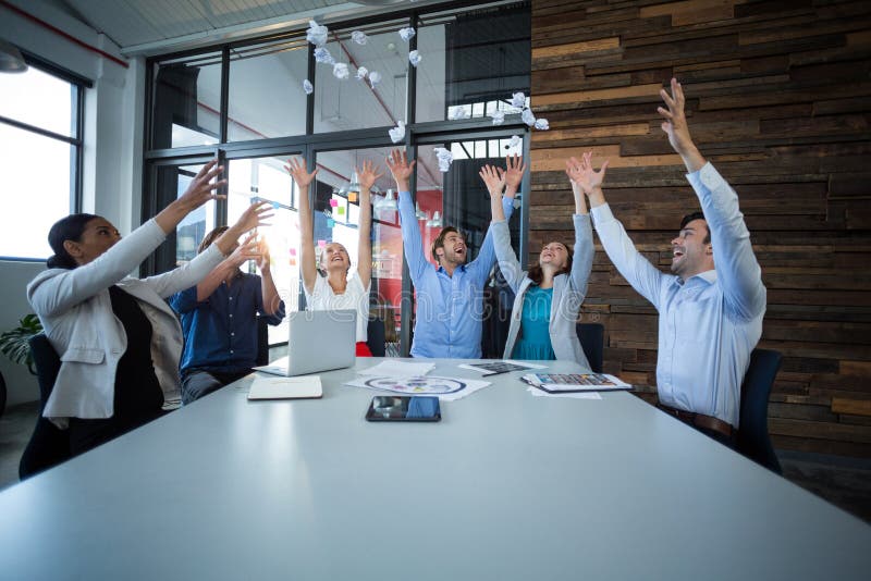 Team of Graphic Designers Throwing Paper Ball Up in Air Stock Photo ...