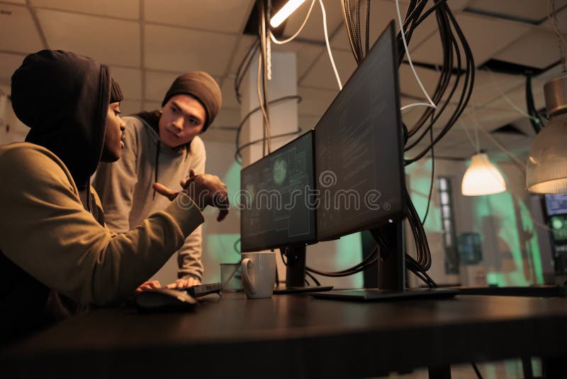 Team of Hackers Looking at Spyware and Phishing Technology Stock Photo ...