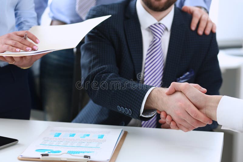 Team Handshake or Joint Greeting in Office after Project Completion and ... Team Handshake or Joint Greeting in Office after Project Completion and ...