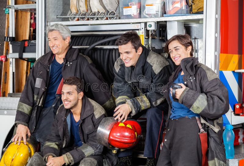 Team of Happy Firefighters by Firetruck Stock Image - Image of people ...
