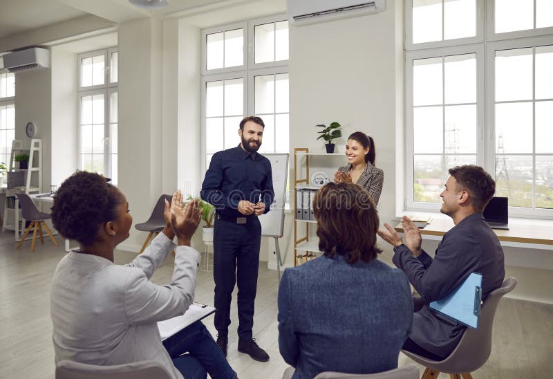 Team of Happy Multiracial Men and Women Applauding a Professional ... Team of Happy Multiracial Men and Women Applauding a Professional ...