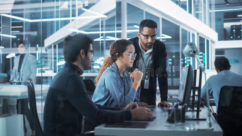Team of Industrial Design Agency Specialists Discussing a 3D Circuit ...