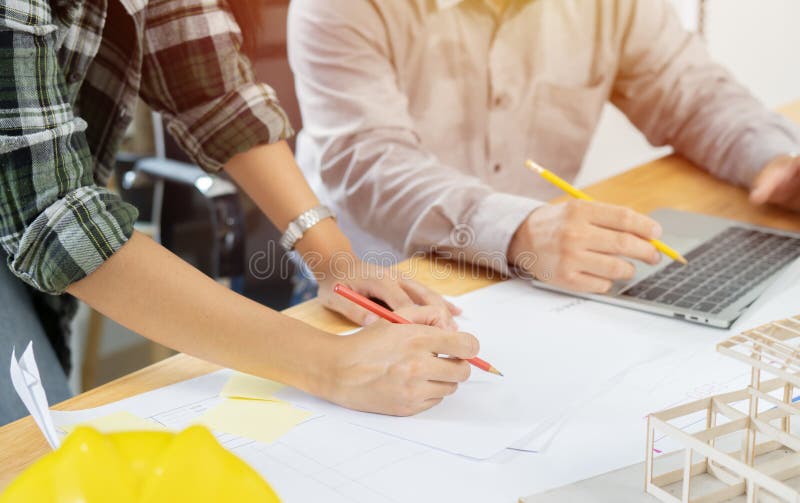 Team of Industrial Engineers Lean on Office Table, Analyze Machinery ...