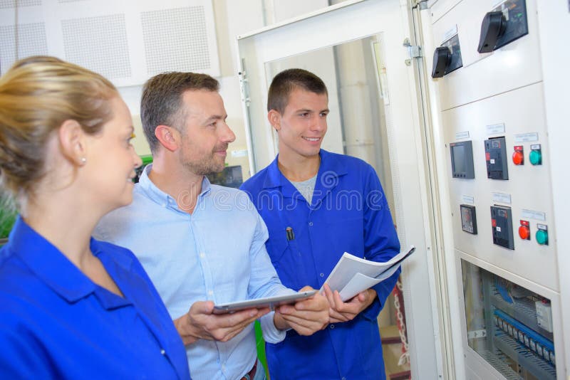 Team Industrial Machine Technicians Stock Photo - Image of business ...