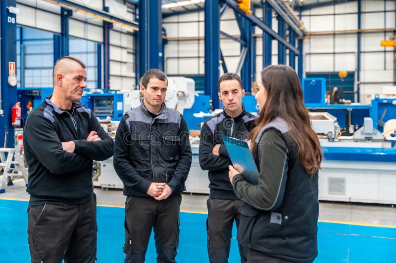 Team of Industrial Technicians Talking Standing in the Facilities Stock ...