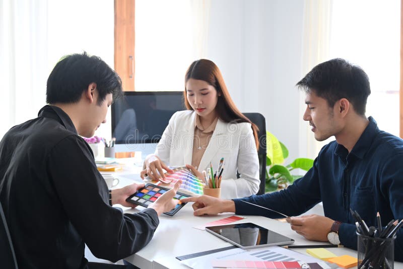 Interior Designers Brainstorming and Working New Project Together at ...