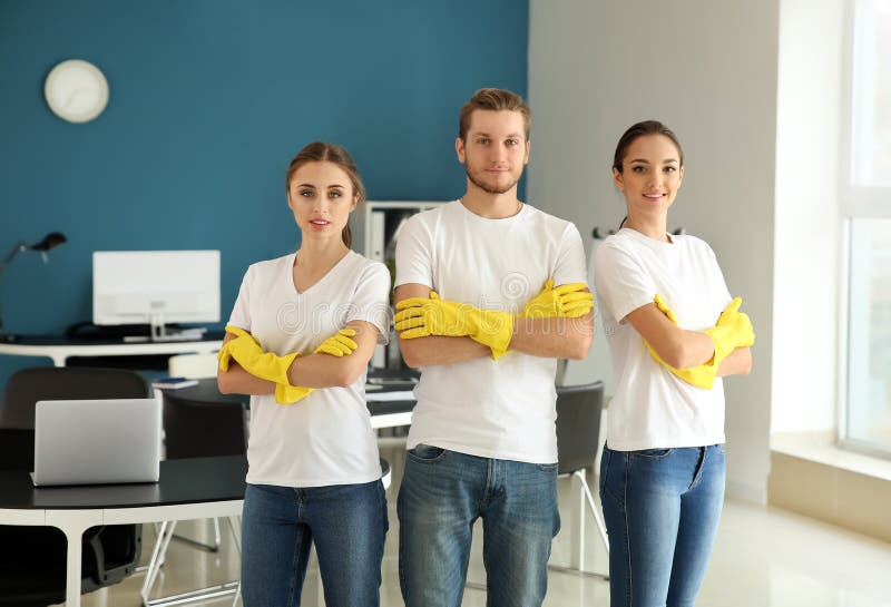 Team of janitors in office stock photo. Image of chores - 151347622