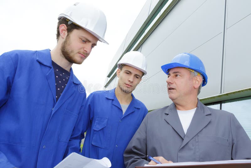 Team laborers with foreman stock image. Image of labor - 103618925