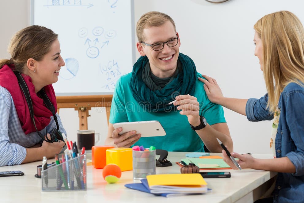Team laughing at work stock photo. Image of employees - 52136452