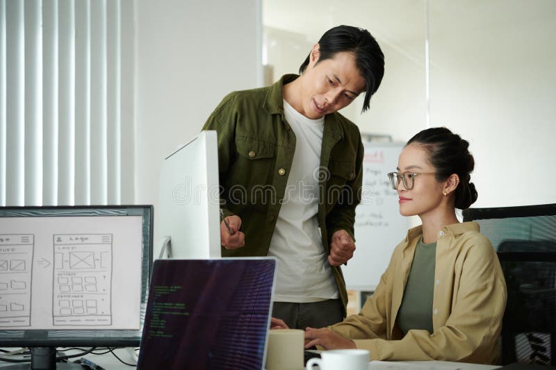 Team Leader Talking To Programmer Stock Photo - Image of coding ...